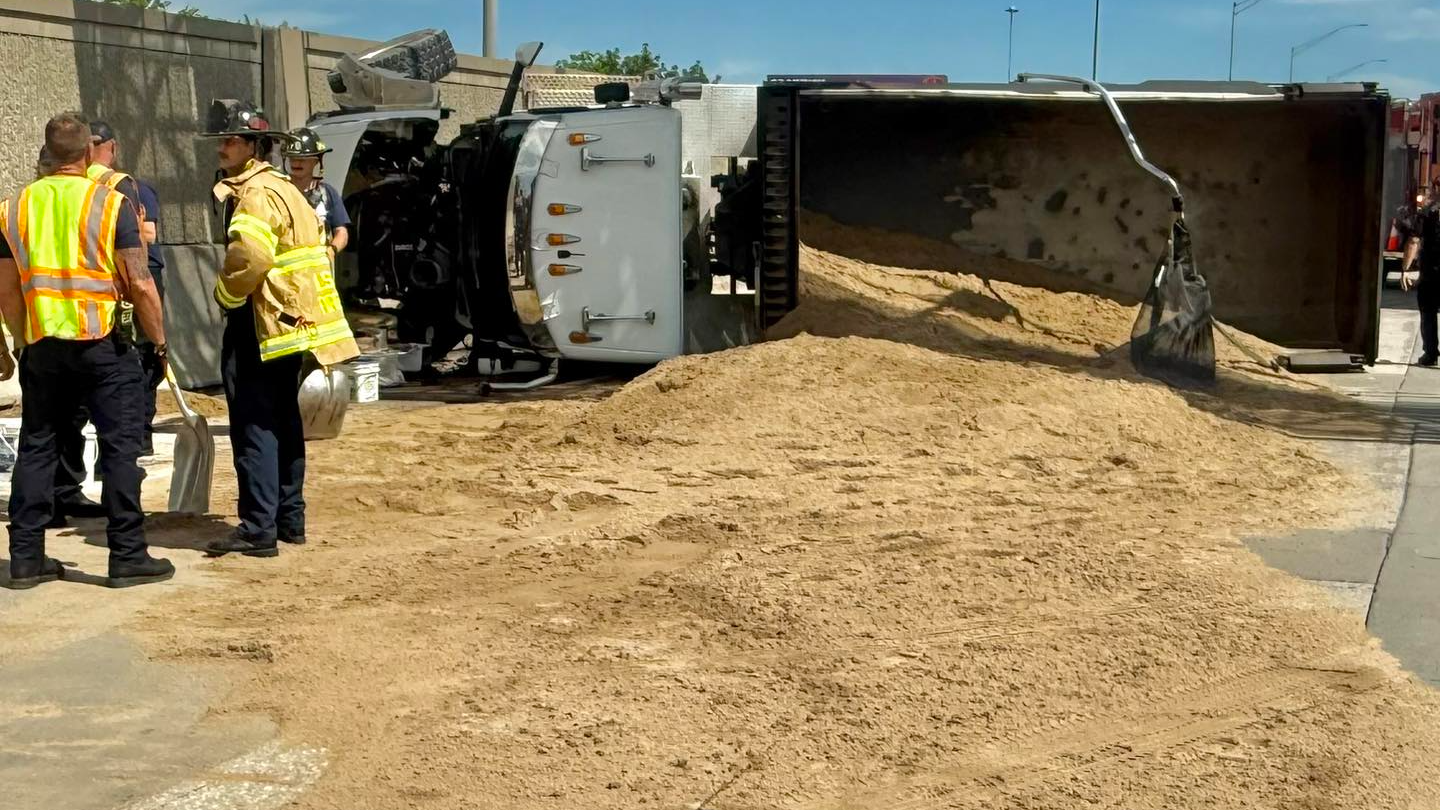 Highway 169 reopened in Tulsa after dump truck overturns and spills sand