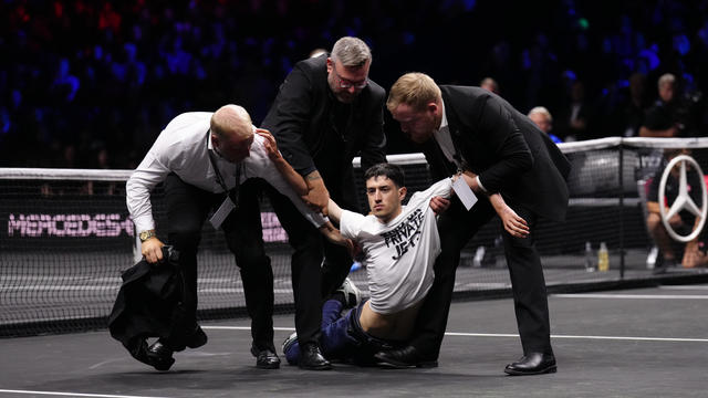 Protestor Lights Arm, Part Of Tennis Court On Fire During Laver Cup